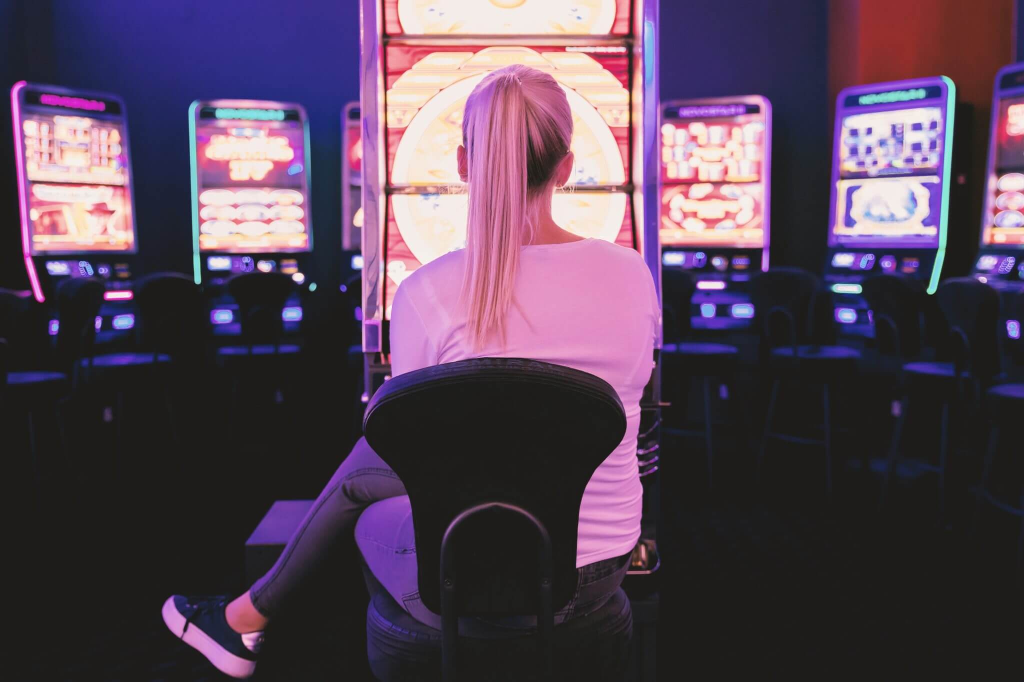woman gambling on a slot machine - Money and Mental Health Policy Institute